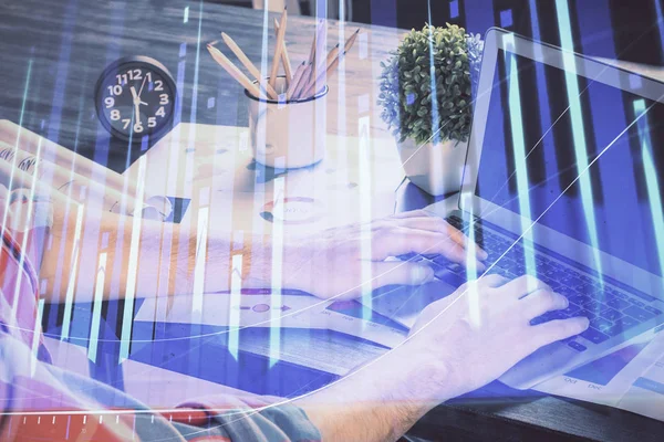 Double exposure of stock graph with businessman typing on computer in ...