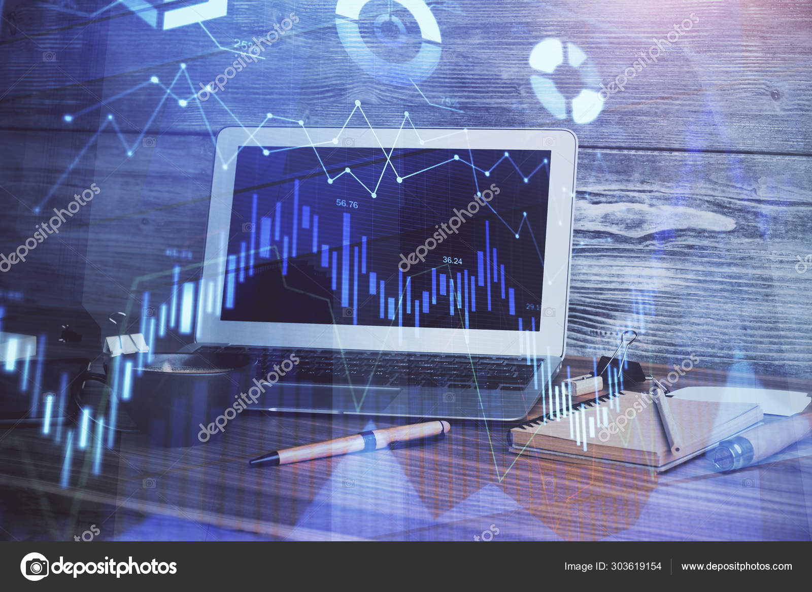 Financial chart drawing and table with computer on background. Double ...