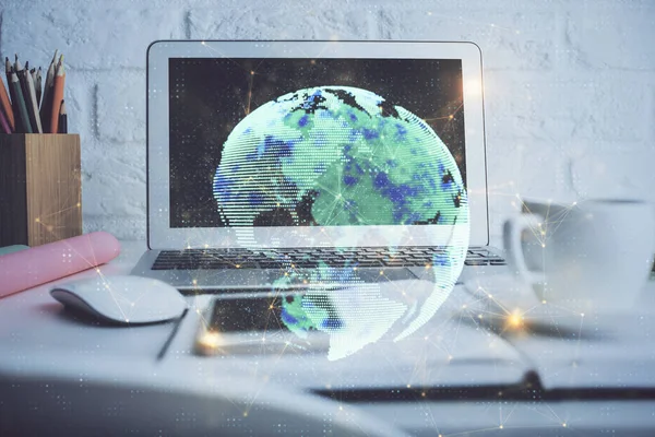 Computer on desktop with social network hologram. Multi exposure ...