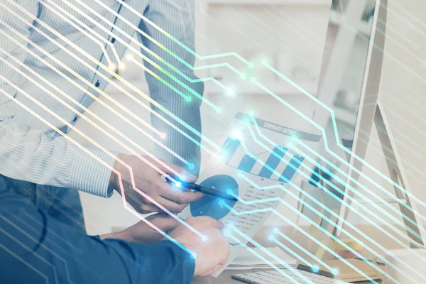 Multi exposure of tech drawings with man working on computer background ...