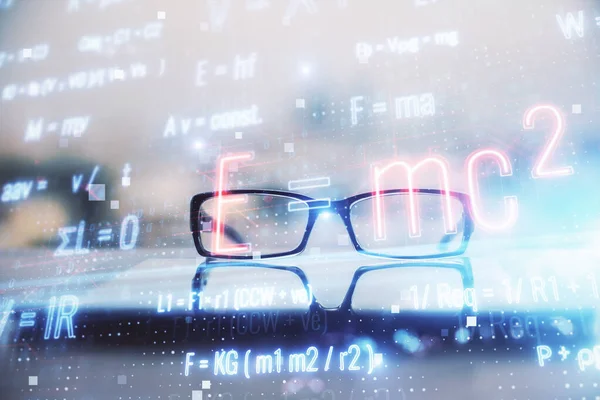 Formulas drawing with glasses on the table background. Concept of ...