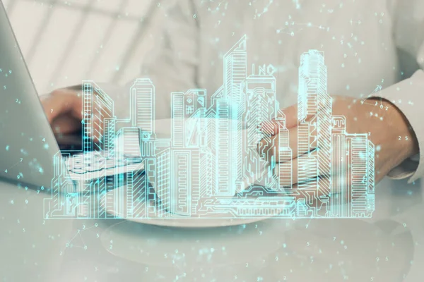 High tech city drawing with businessman working on computer on ...