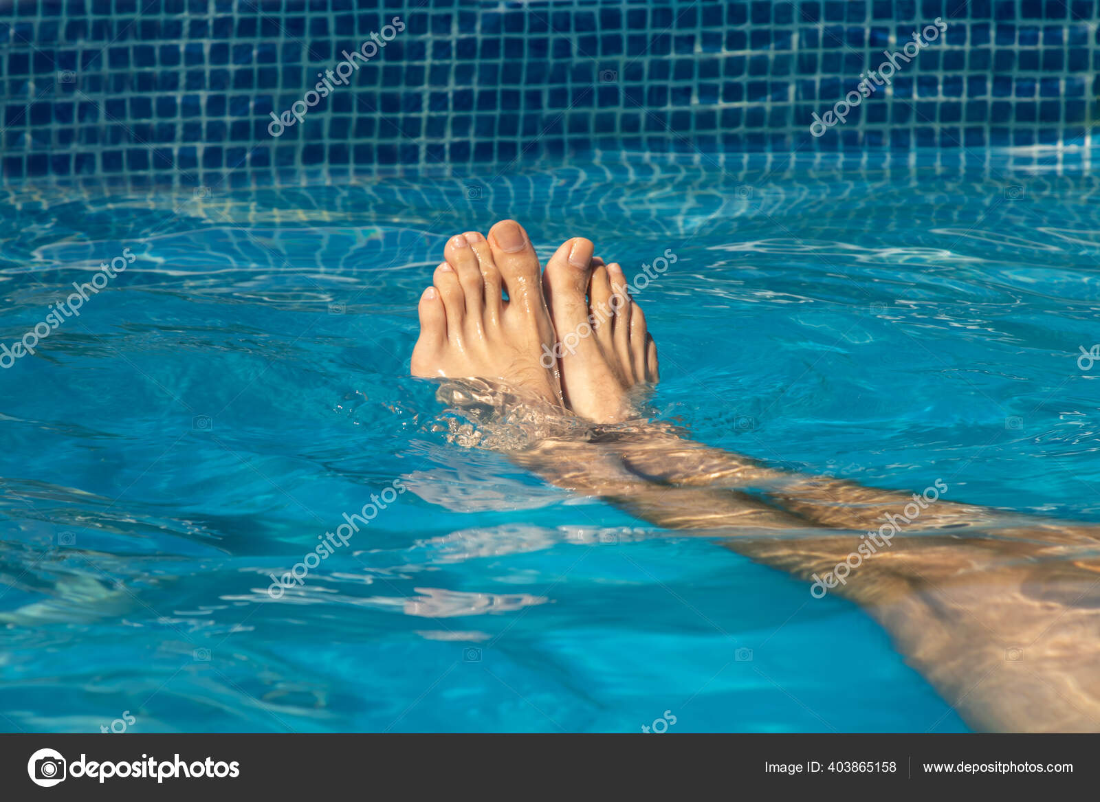 Feet Floating Pool Relaxed Stock Photo by ©carballo 403865158