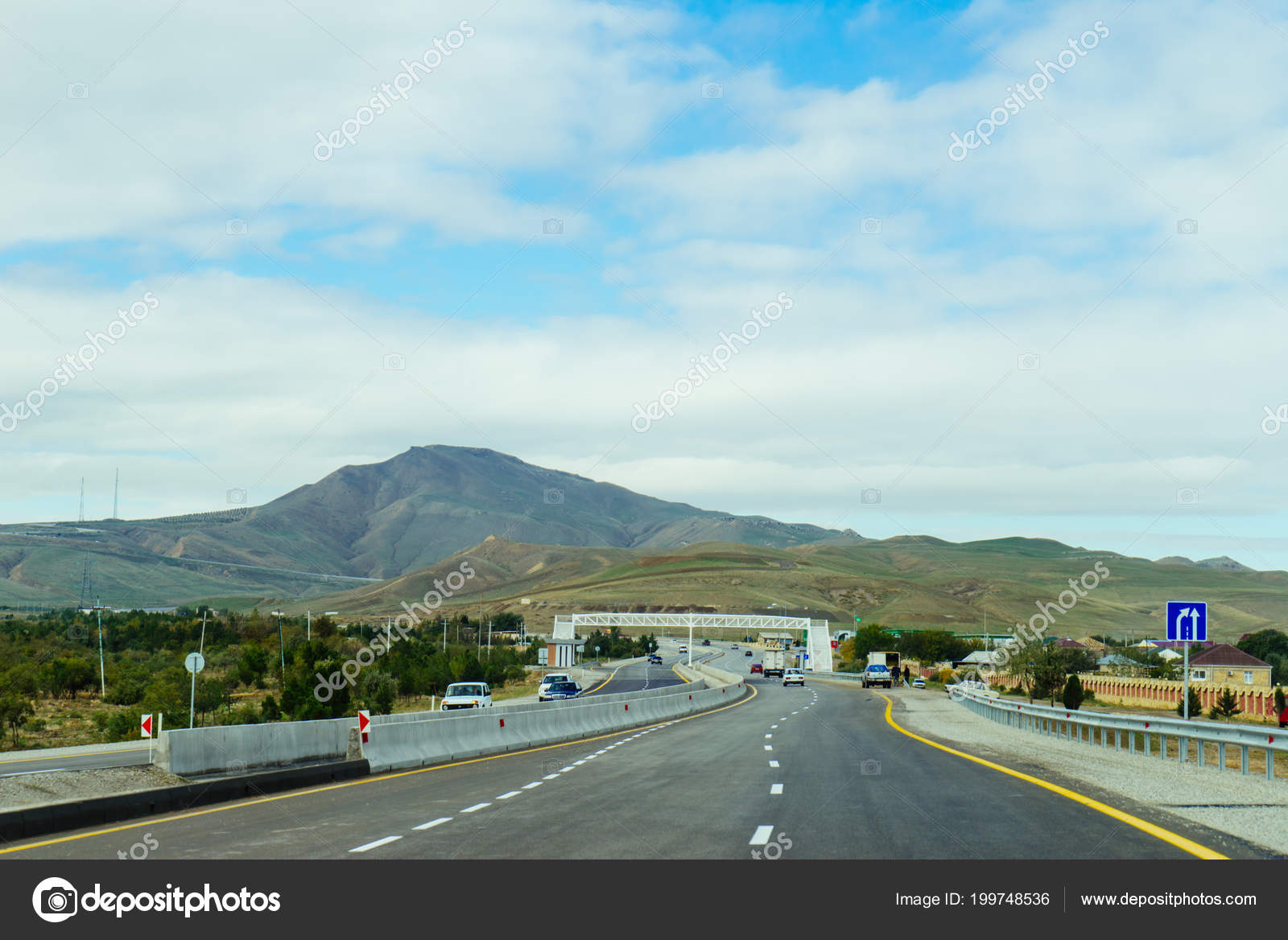 A direct road at the foot of the mountains, a beautiful spellbinding ...