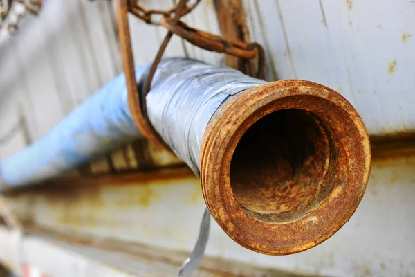 An abstract image of old rusted industrial hoses and hoses connectors ...