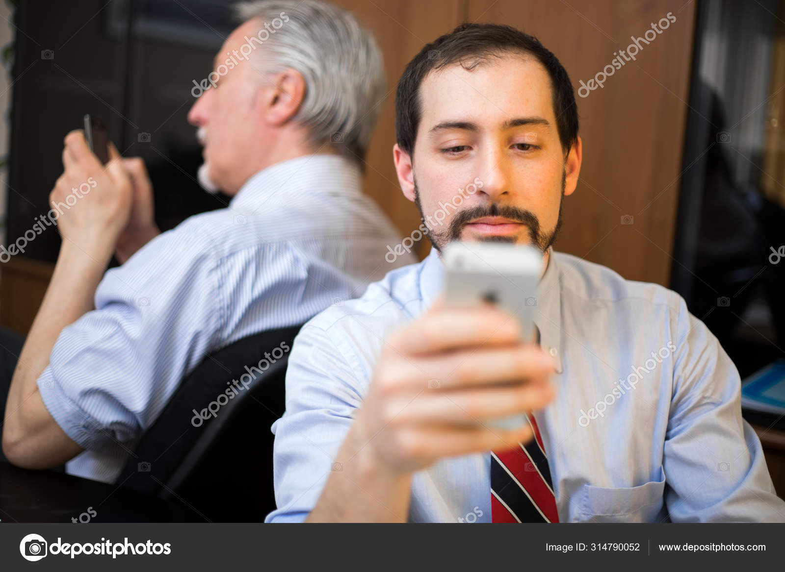 Two Lazy Businessmen Using Phones Instead Working Stock Photo by ...