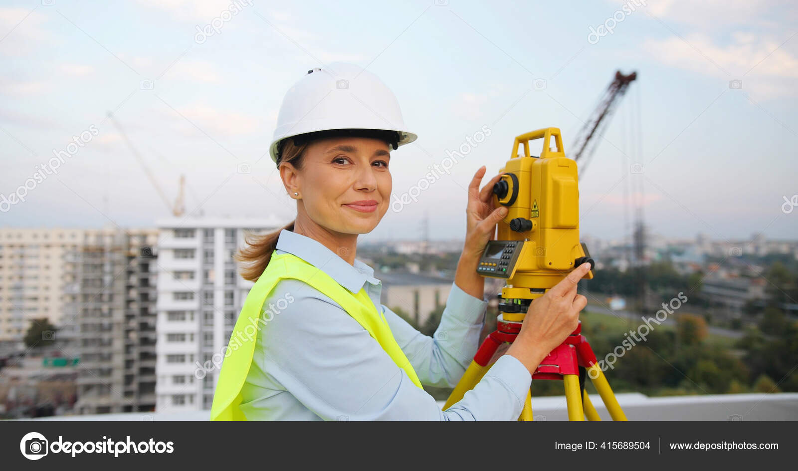Female construction manager and engineer wearing protective helmet with ...