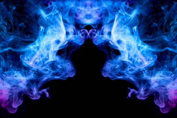 Dense multicolored smoke of blue and purple colors in the form of a ...