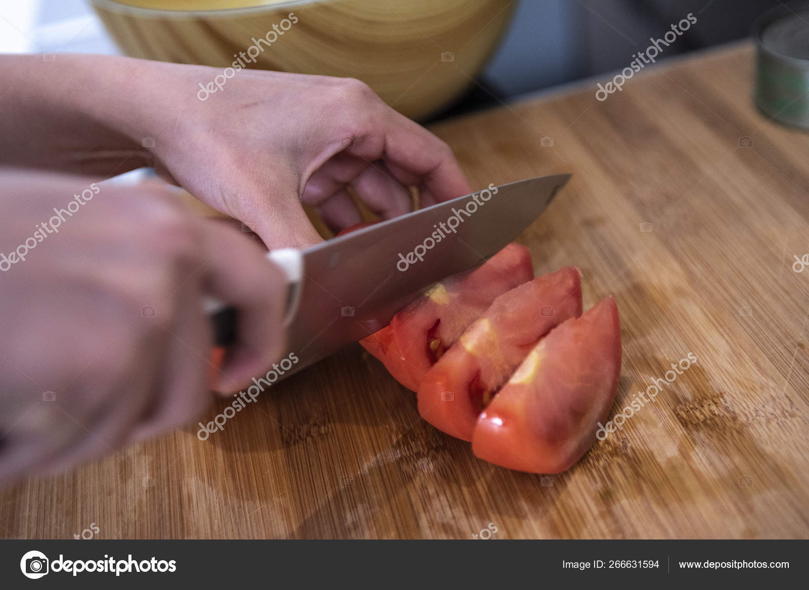 Hands holding sharp knife and chopping Stock Photo by ©fotonomada 266631594