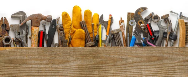 Worn wood plank on used and dirty work tools for home improvement or ...