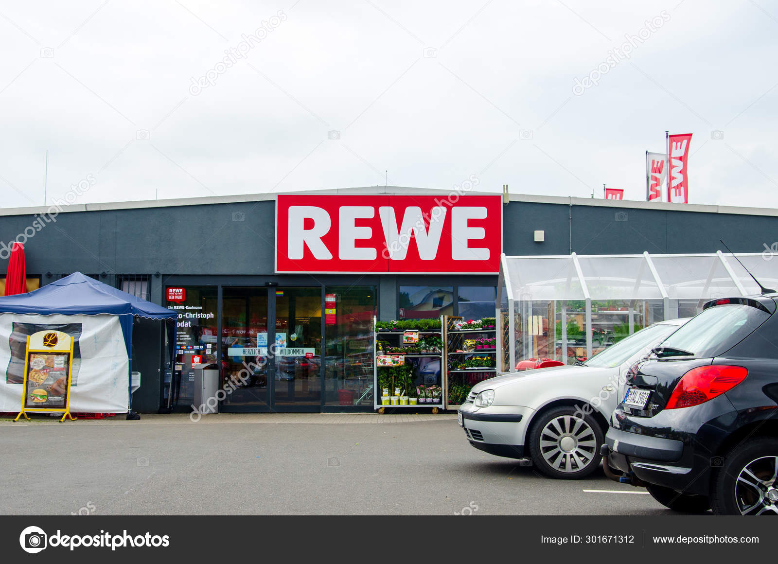REWE supermarket. The REWE Group is a German diversified retail and ...