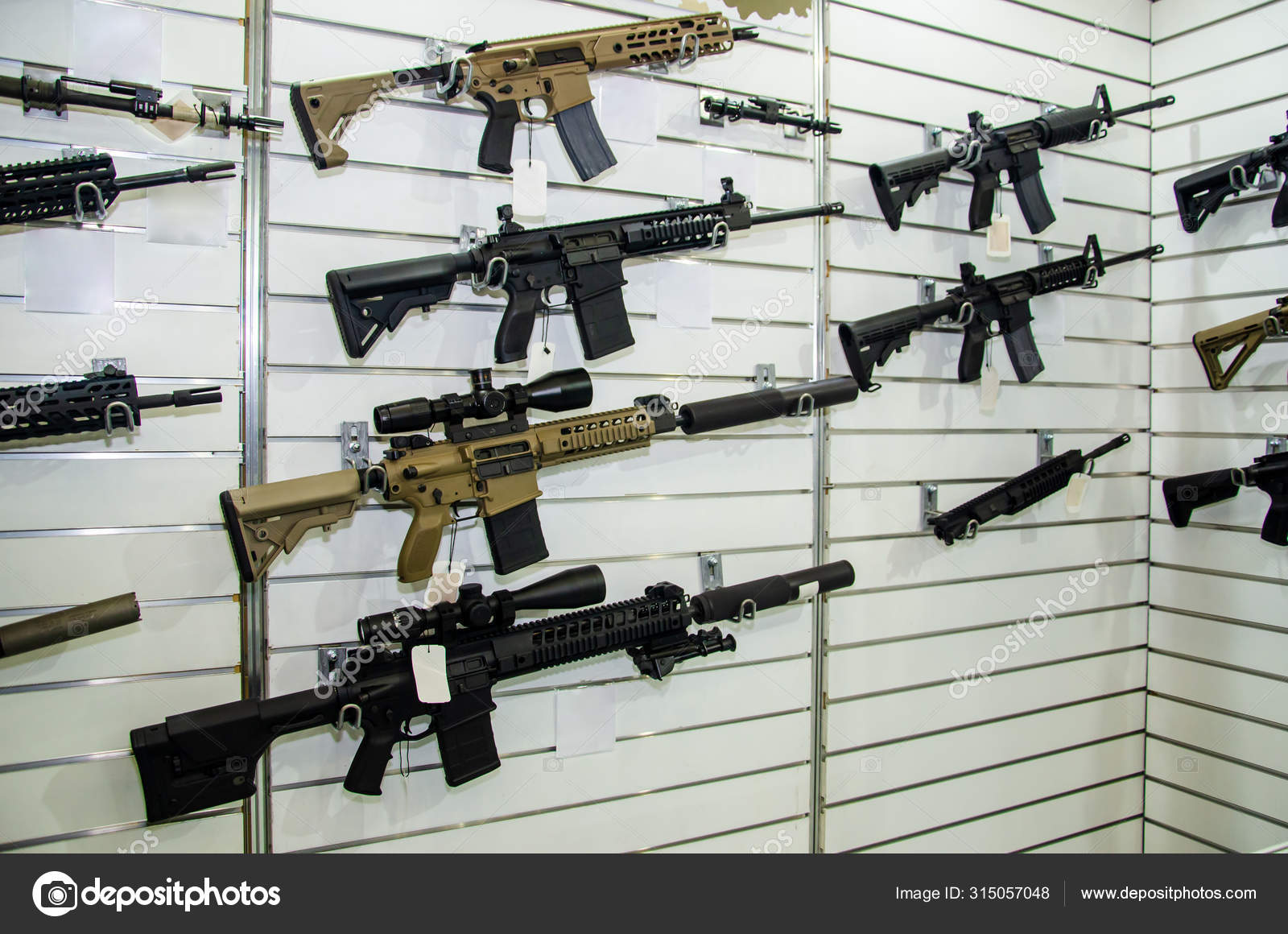 Gun wall rack with rifles Stock Photo by ©Oleksandr_UA 315057048