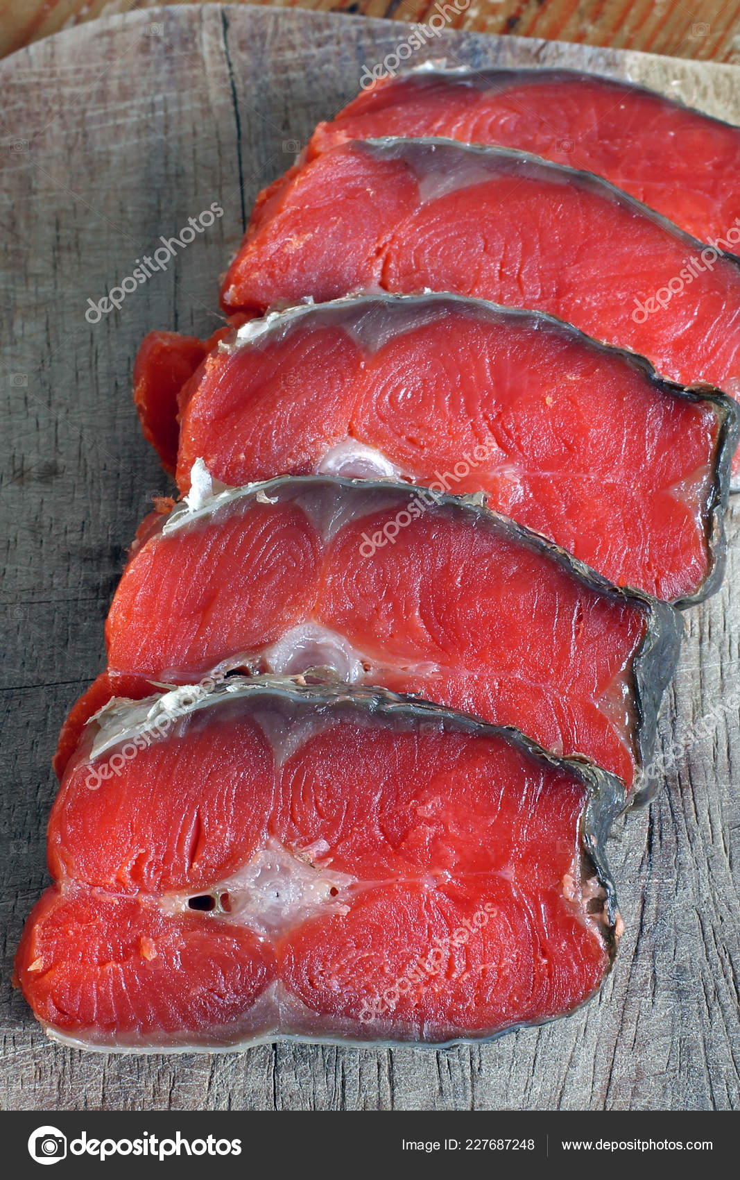 Red Fish Sliced Red Fish Cutting Board Stock Photo by ©amor7 227687248