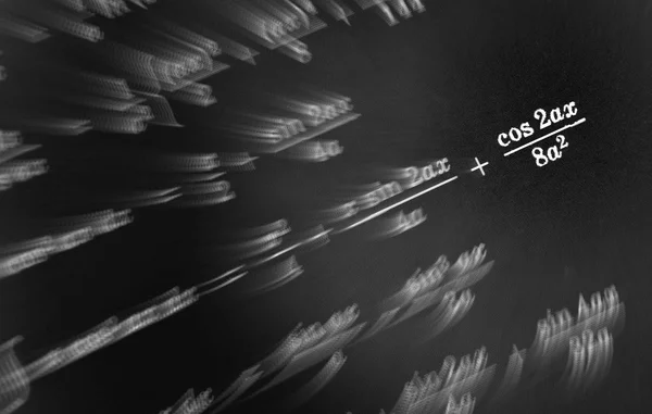 Large number of mathematical formulas focus zoom on a black background ...