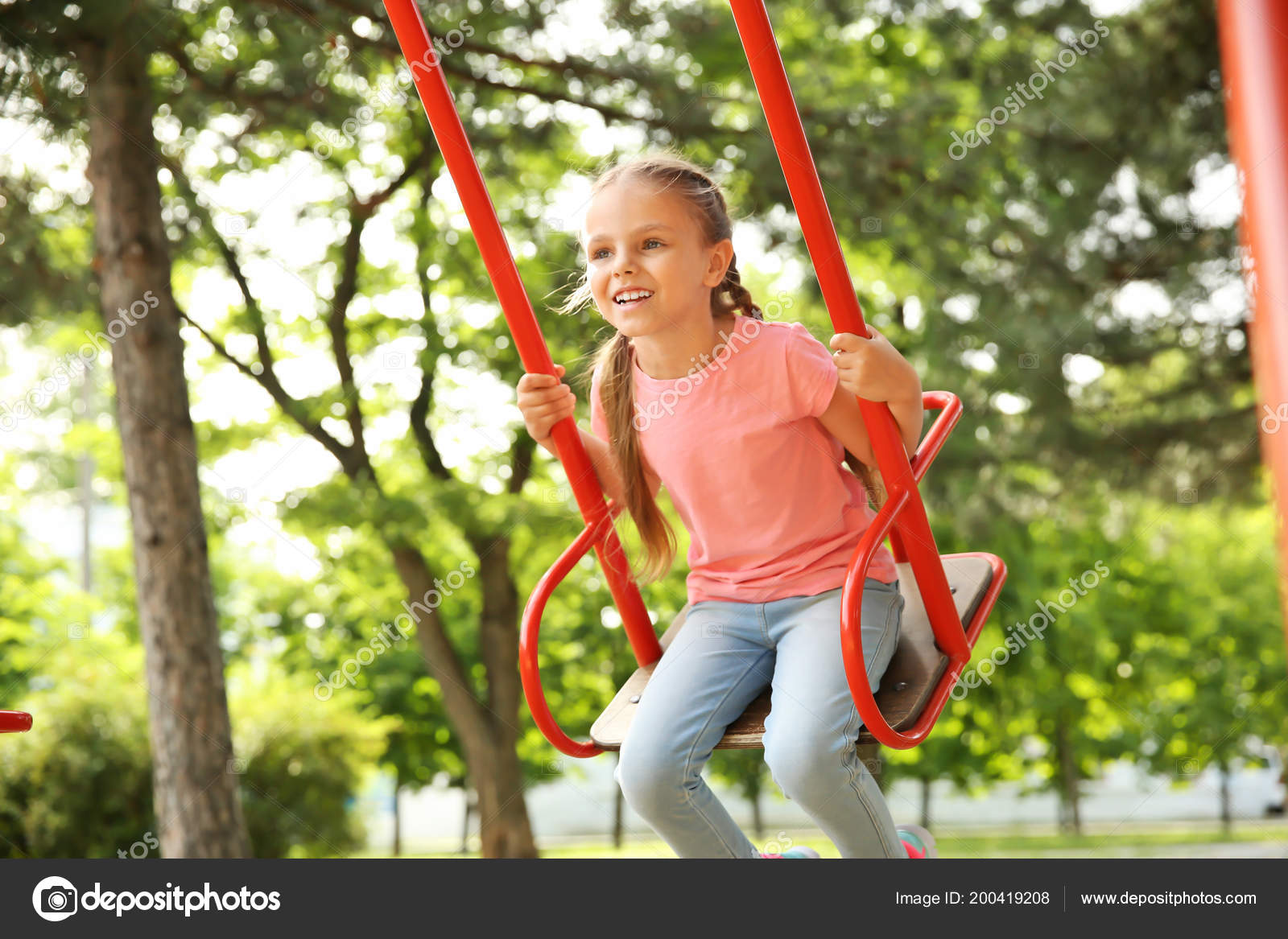 Cute Little Girl Playing Swings Park Stock Photo by ©belchonock 200419208