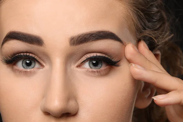 Young woman with beautiful eyebrows, closeup - Stock Image - Everypixel