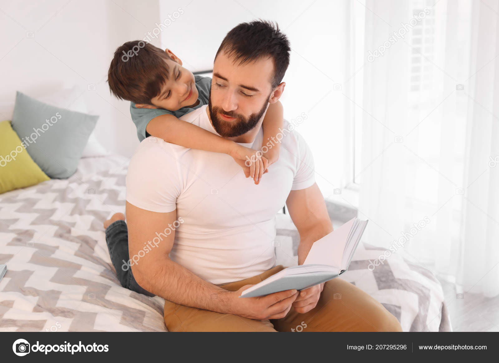 Father reading book to his little son at home Stock Photo by ...