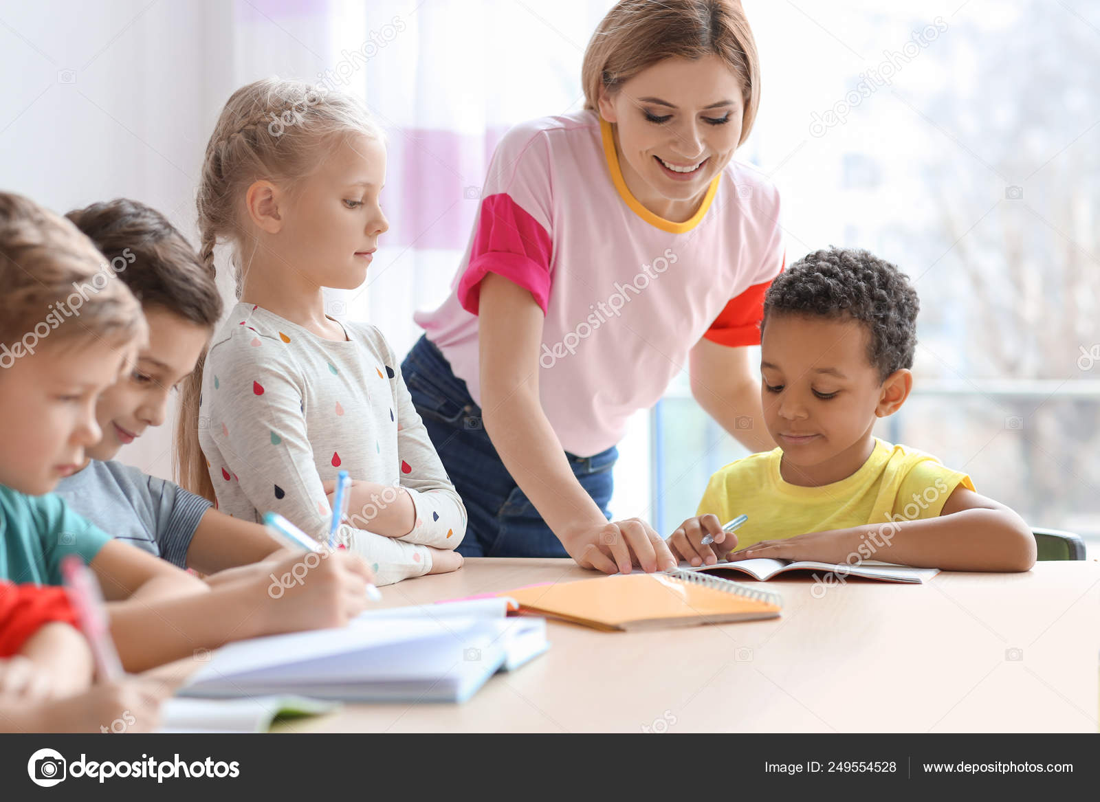 Teacher Helping Child