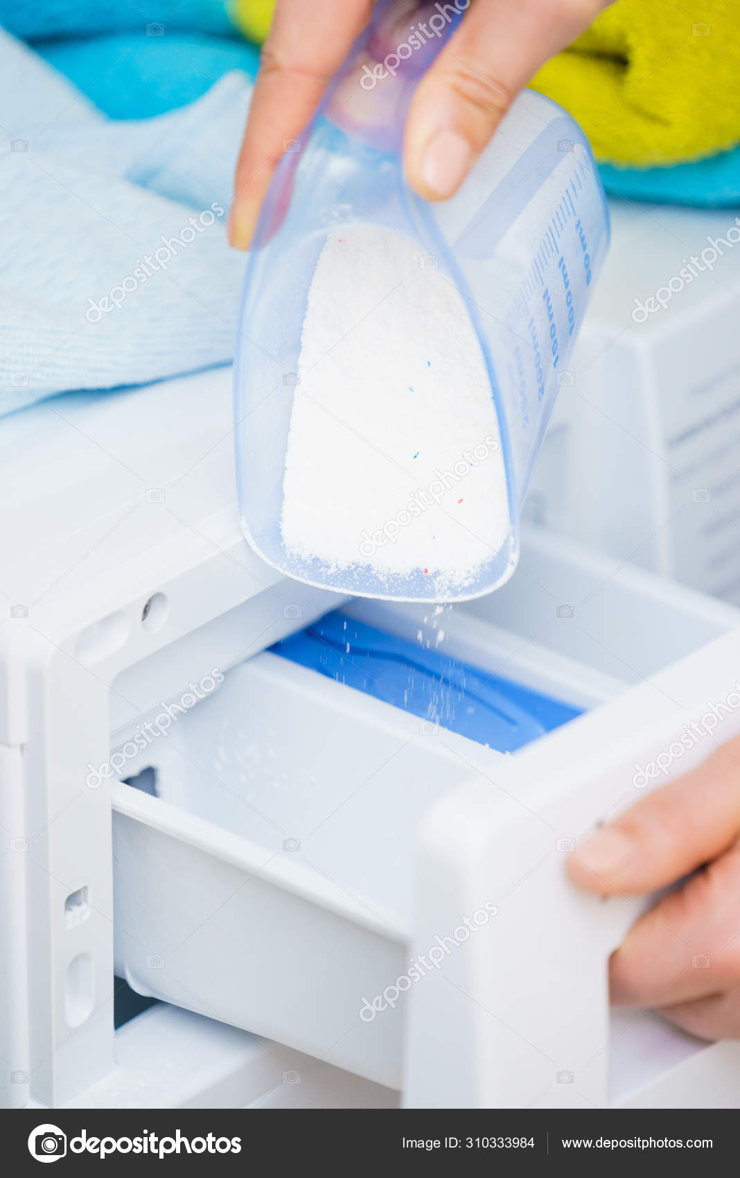 Laundry washing powder detergent Stock Photo by ©Anetlanda 310333984