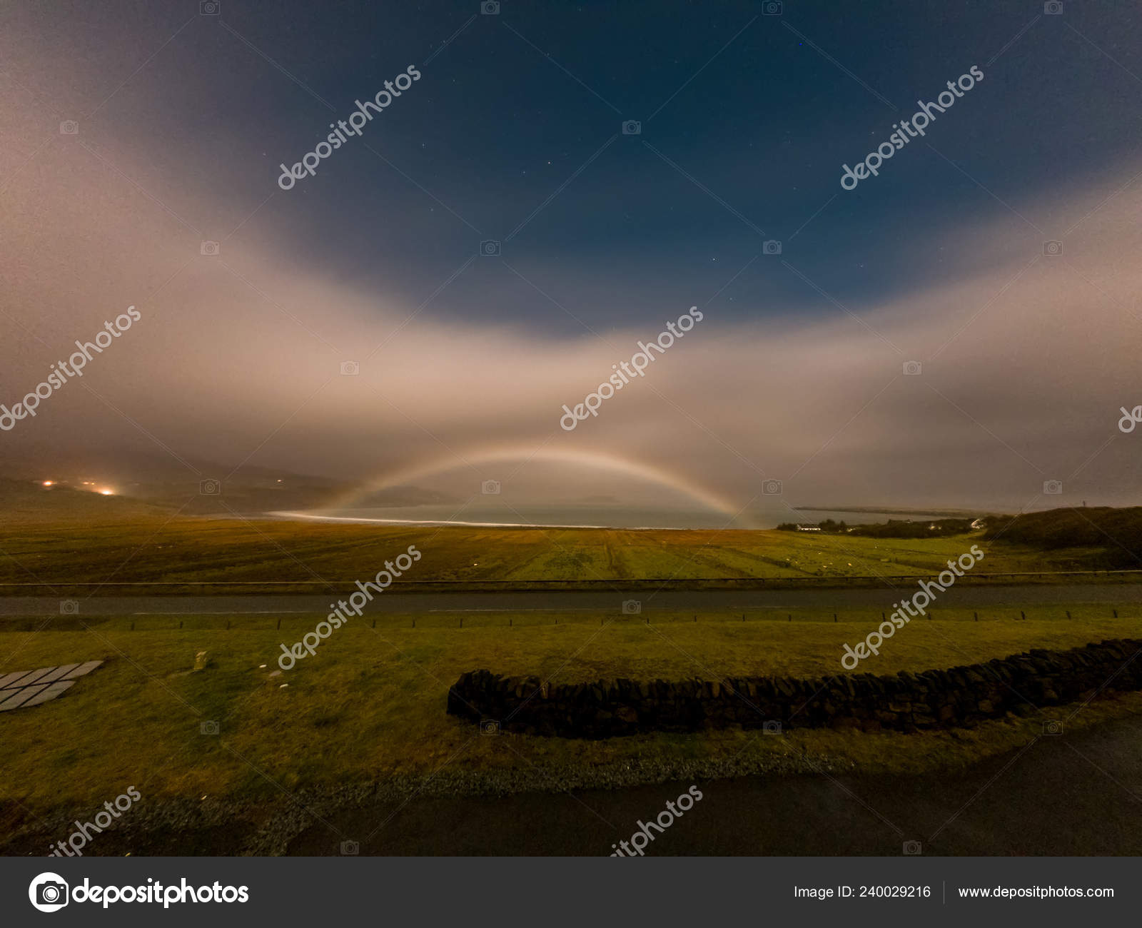 Very rare moonbow during the night above Staffin bay Stock Photo by ...