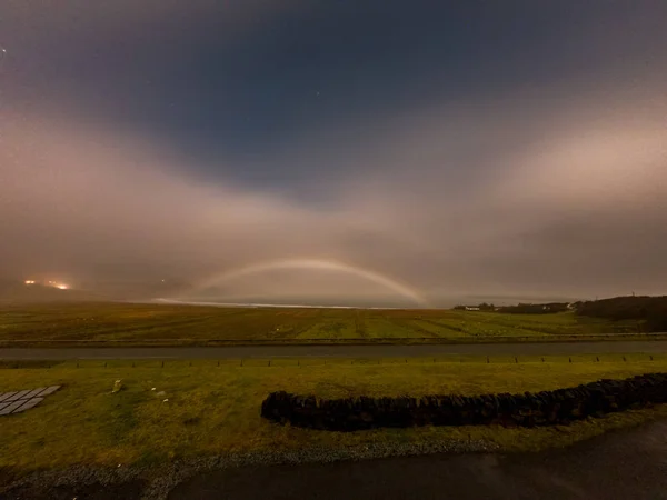 Very rare moonbow during the night above Staffin bay Stock Photo by ...