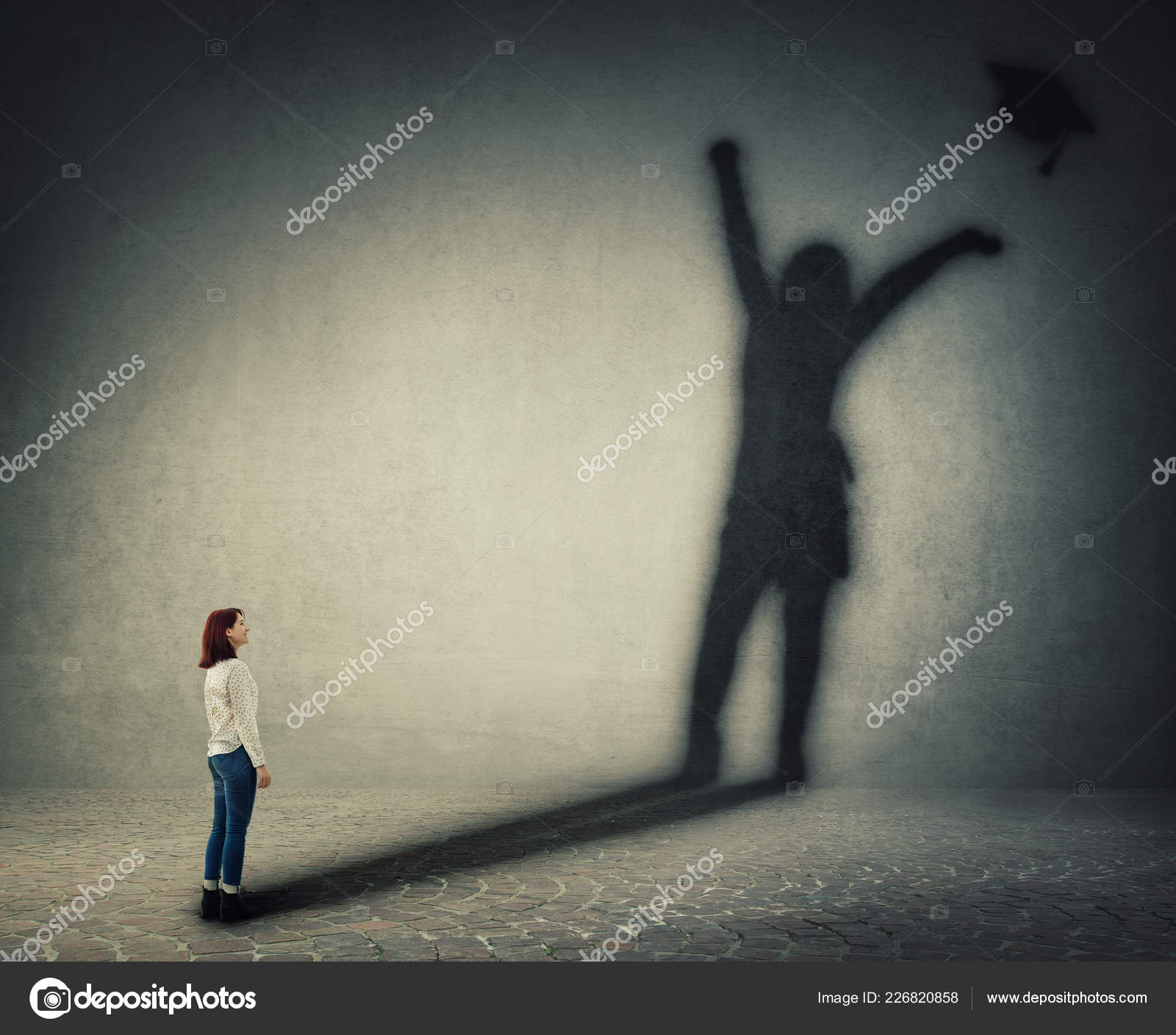 Full Length Female Student Casting Shadow Wall Celebrating Hands ...