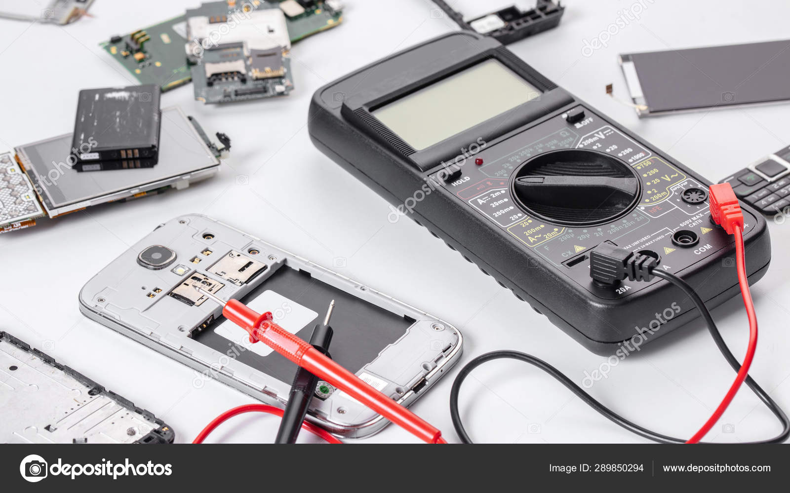 Disassembled mobile phone and tools Stock Photo by ©JamaL1977a 289850294