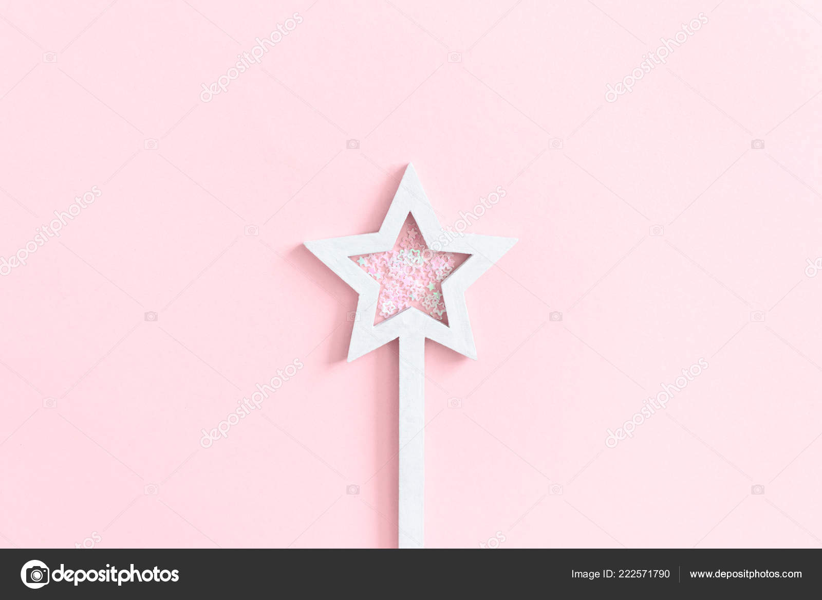 Star shaped magic wand with sequins on a pink pastel background Stock ...