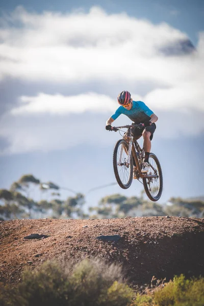 Close up image of a mountain biker speeding downhill on a mountain bike ...