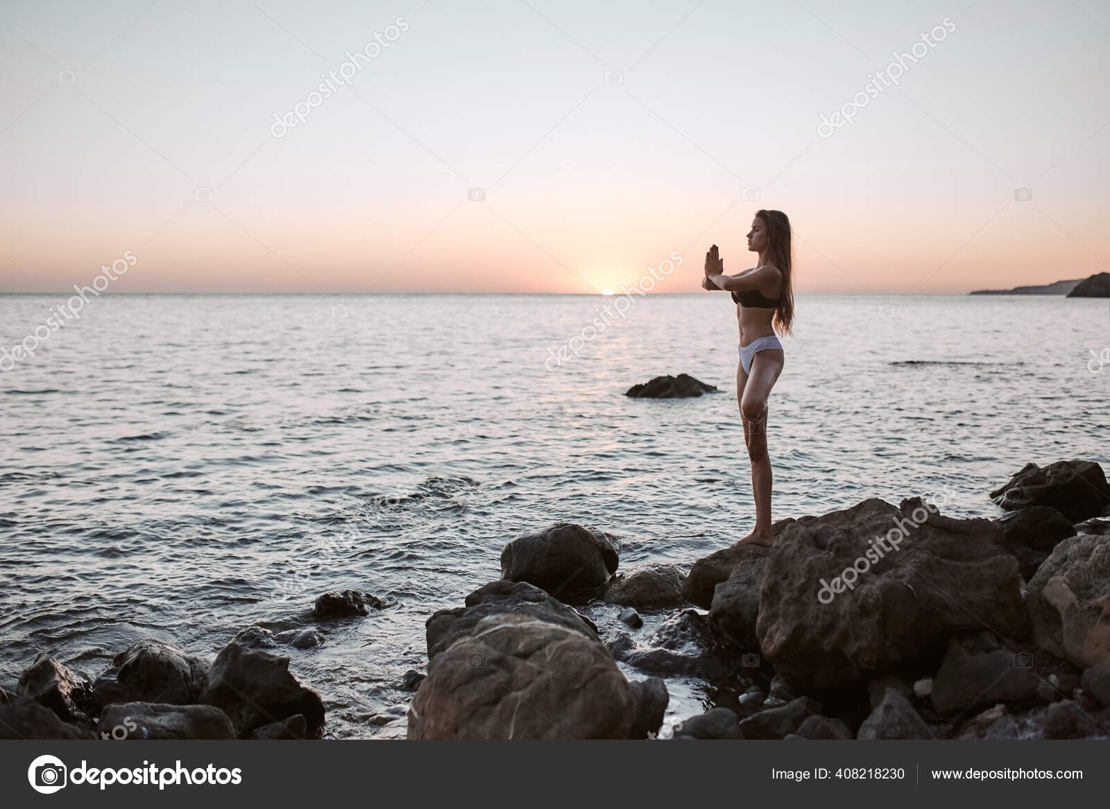 Lady balancing on one leg. Woman training outdoors on fresh air ...