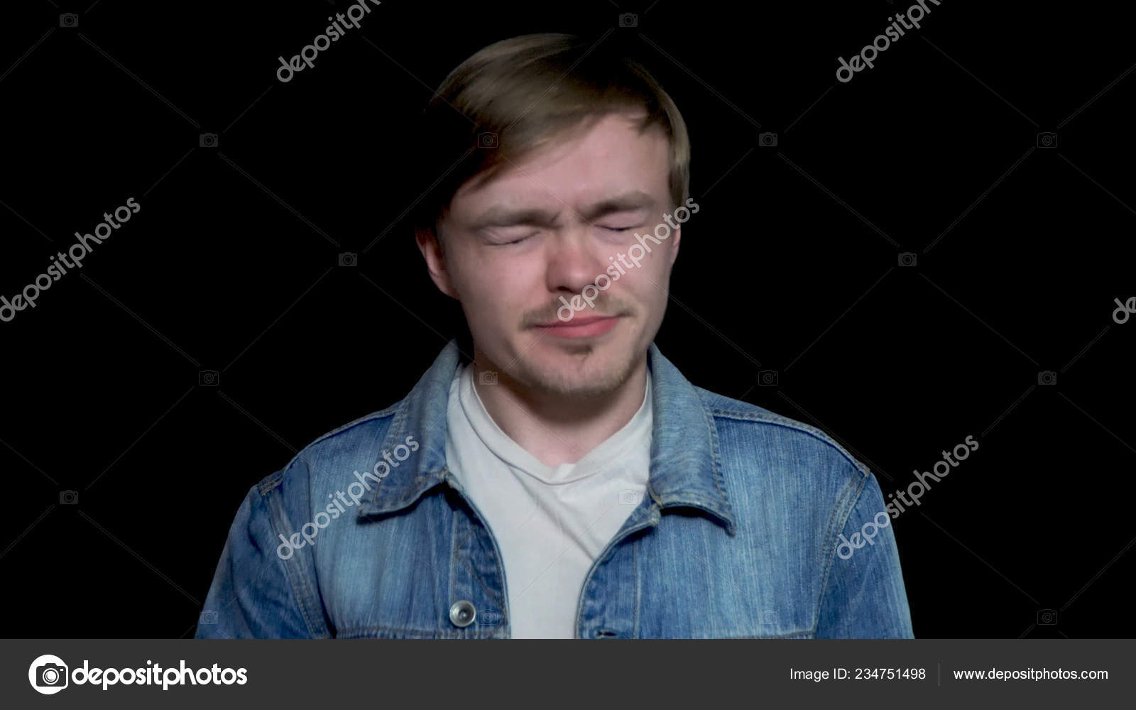 Tired, sleepy, young man yawning, touching his head with a hand ...
