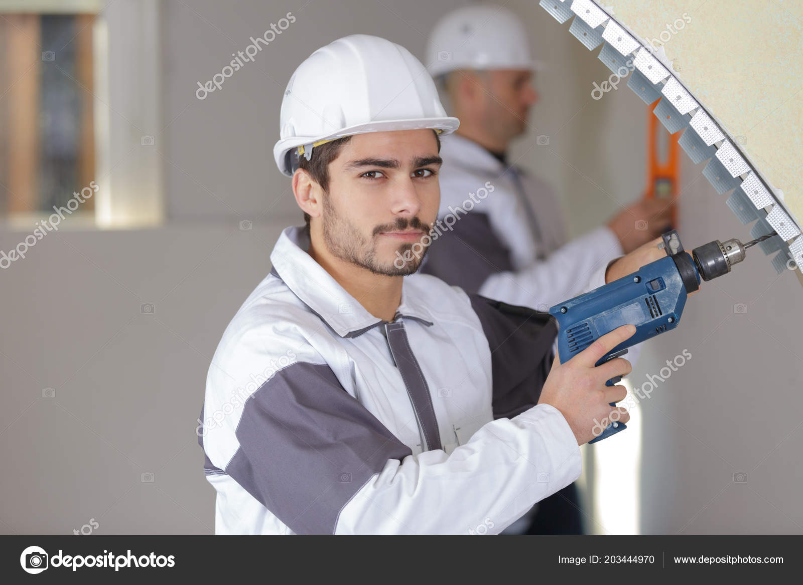 Young man with a drill Stock Photo by ©photography33 203444970