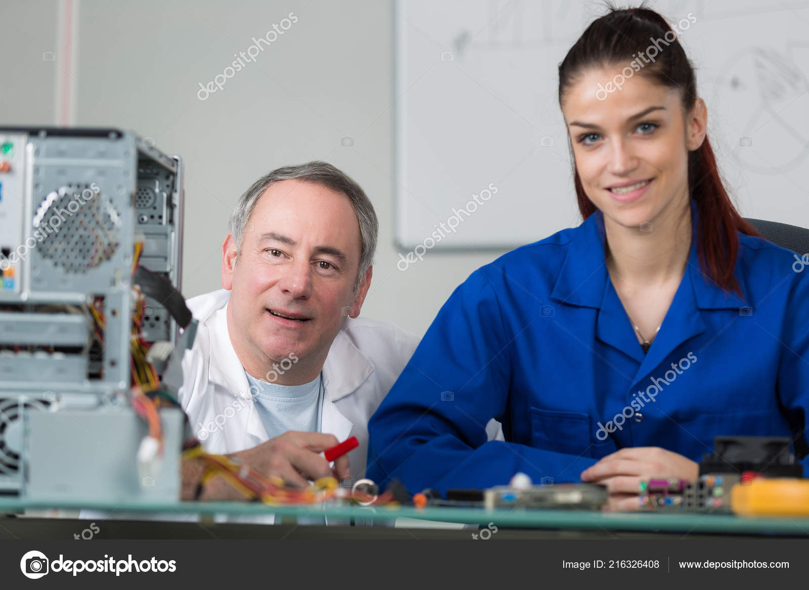 Portrait Smiling Young Woman Learning Fixing Computer Stock Photo by ...