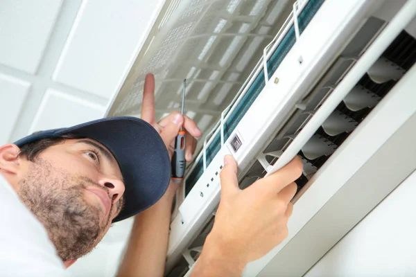 Man working on air conditioning unit Stock Photo by ©photography33 ...