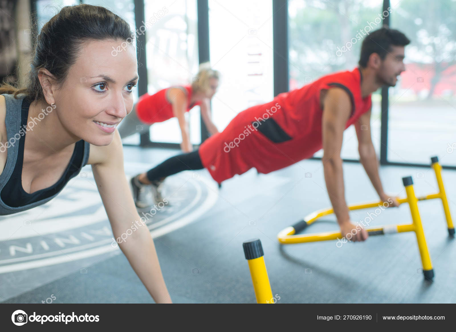 Group at a gym doing push ups Stock Photo by ©photography33 270926190