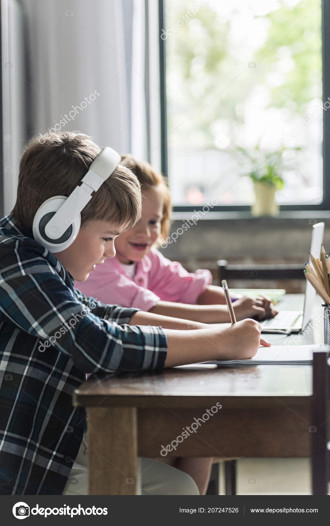 Side View Little Schoolboy Drawing Color Pencils While His Sister Stock ...