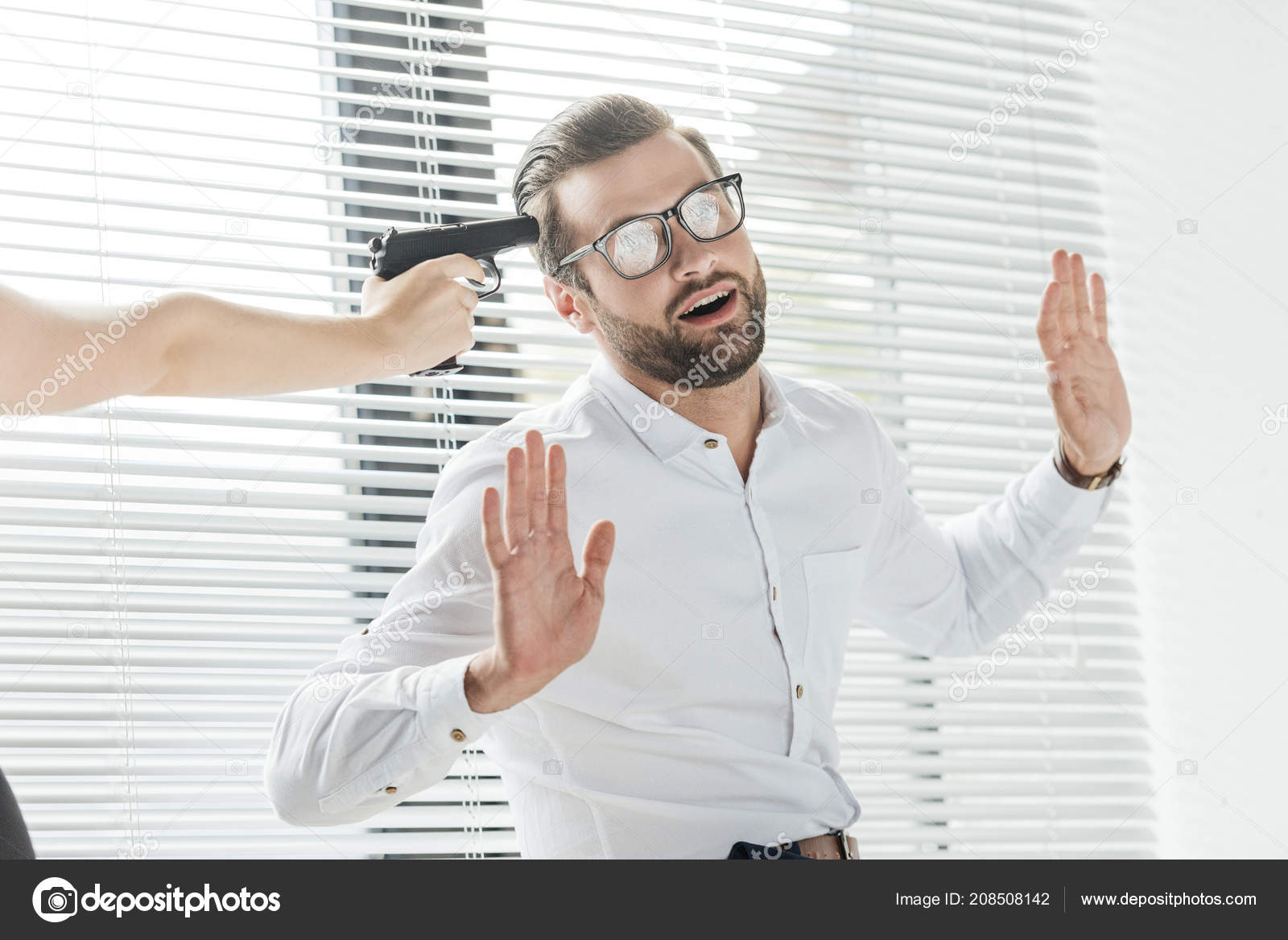 Hand Holding Gun To Head