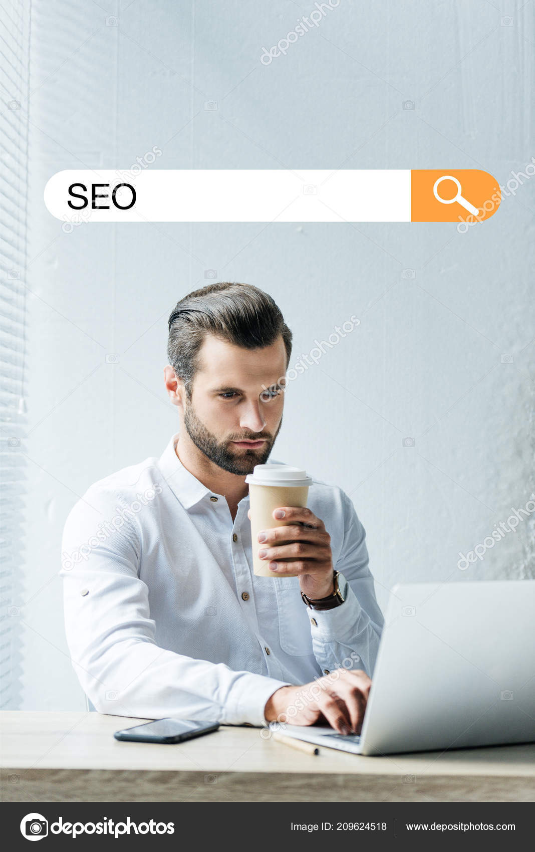 Concentrated Developer Holding Coffee While Working Laptop Seo Search ...