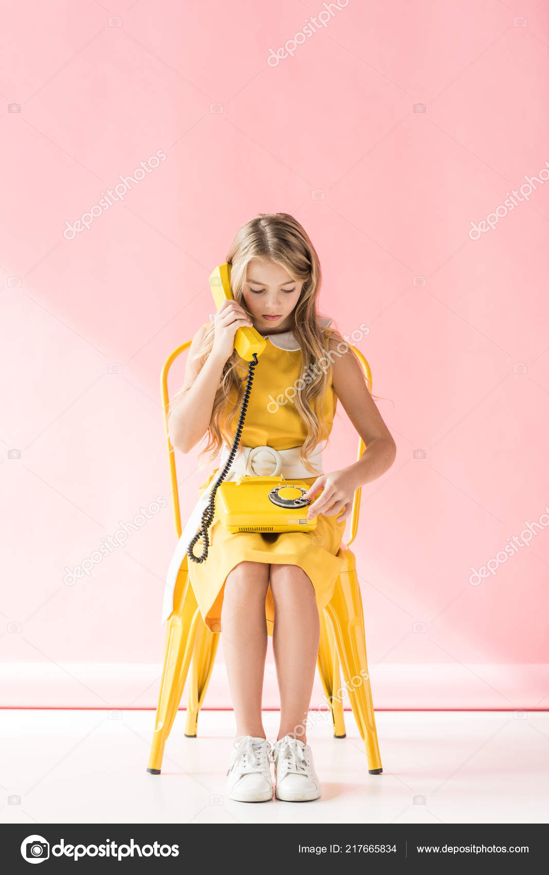 Adorable Youngster Making Call Rotary Telephone While Sitting Yellow ...