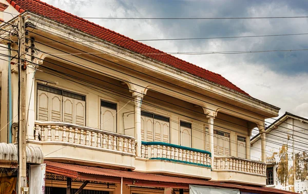 Old French Colonial Building with fading paint and chipped concrete in ...