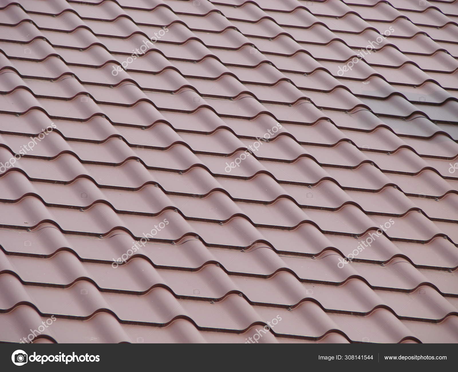 A tiled roof of a building with a wire loop on it Stock Photo by ...