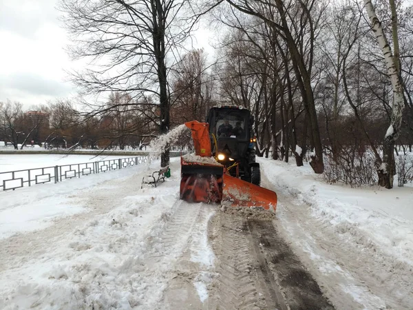 Snow removal by tractor Stock Photos, Royalty Free Snow removal by ...