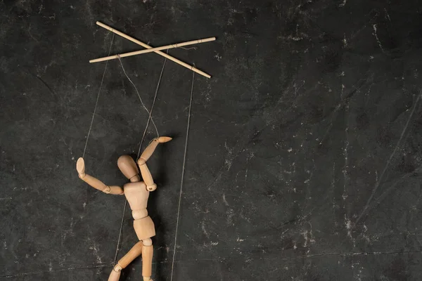 Puppet in the hands of puppeteer walks on isolated, background. Object ...