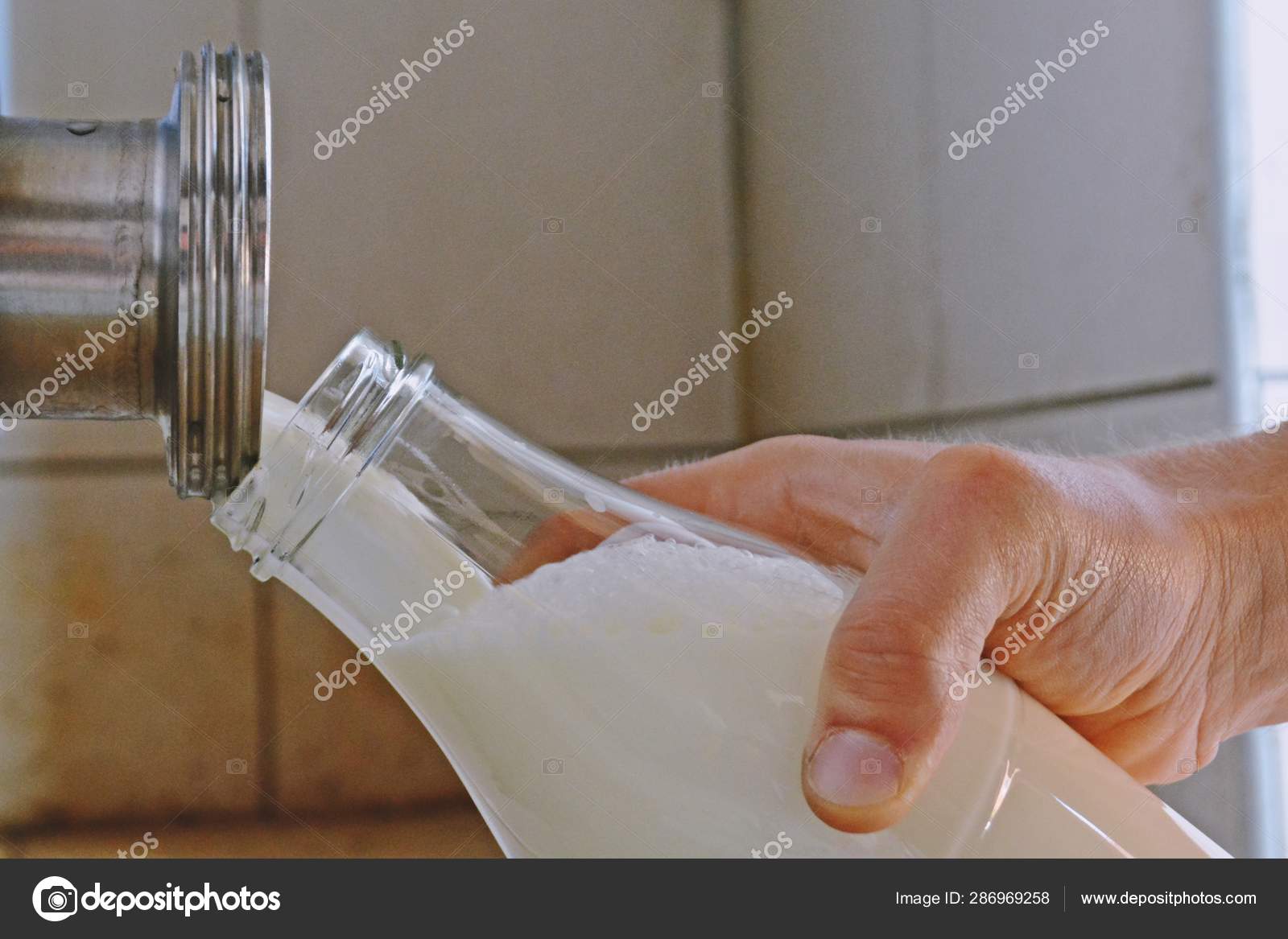 Cropped Image Man Pouring Milk Glass Stock Photo by ©maddas 286969258
