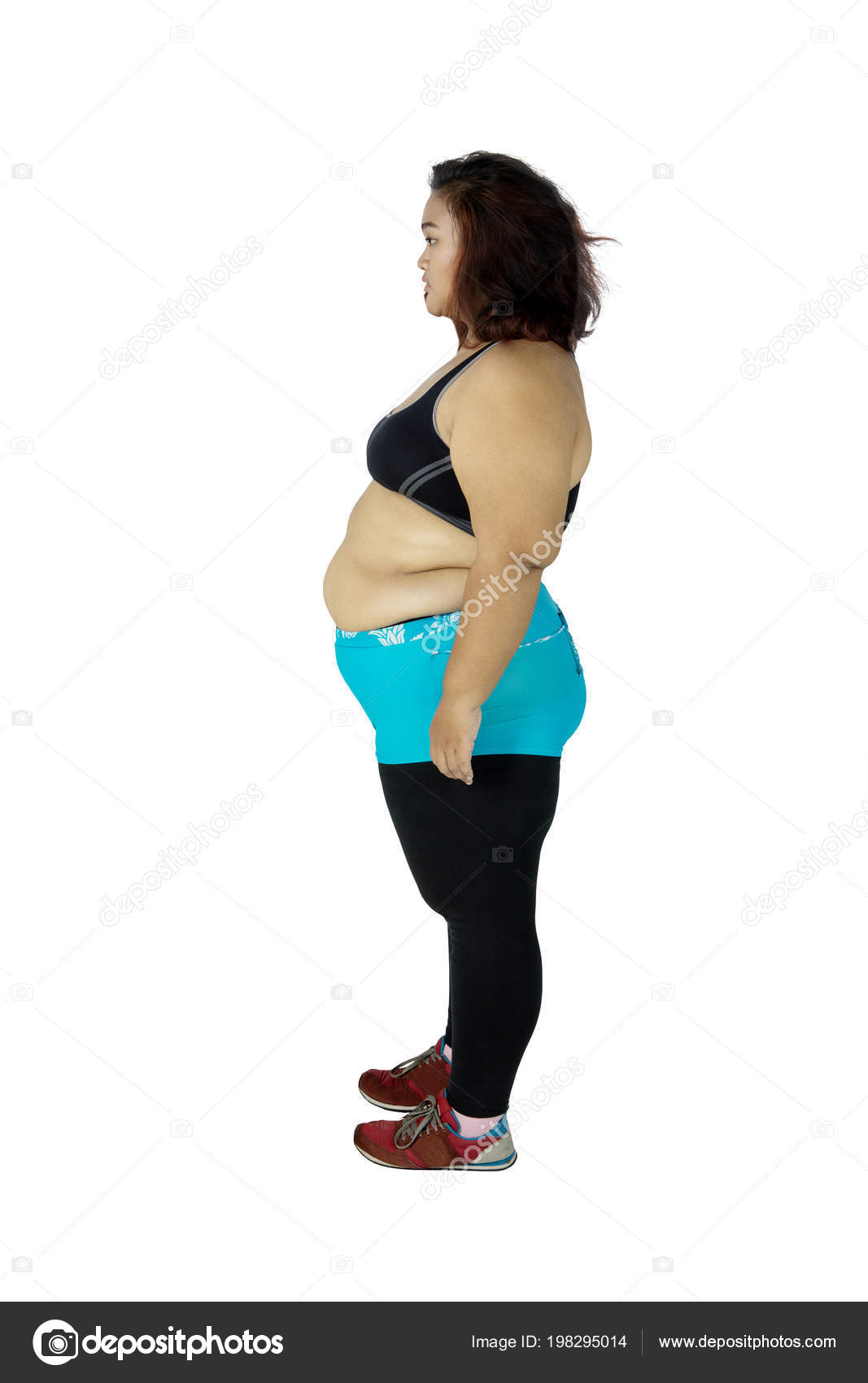 Side View Obese Woman Looks Pensive While Wearing Sportswear Standing ...