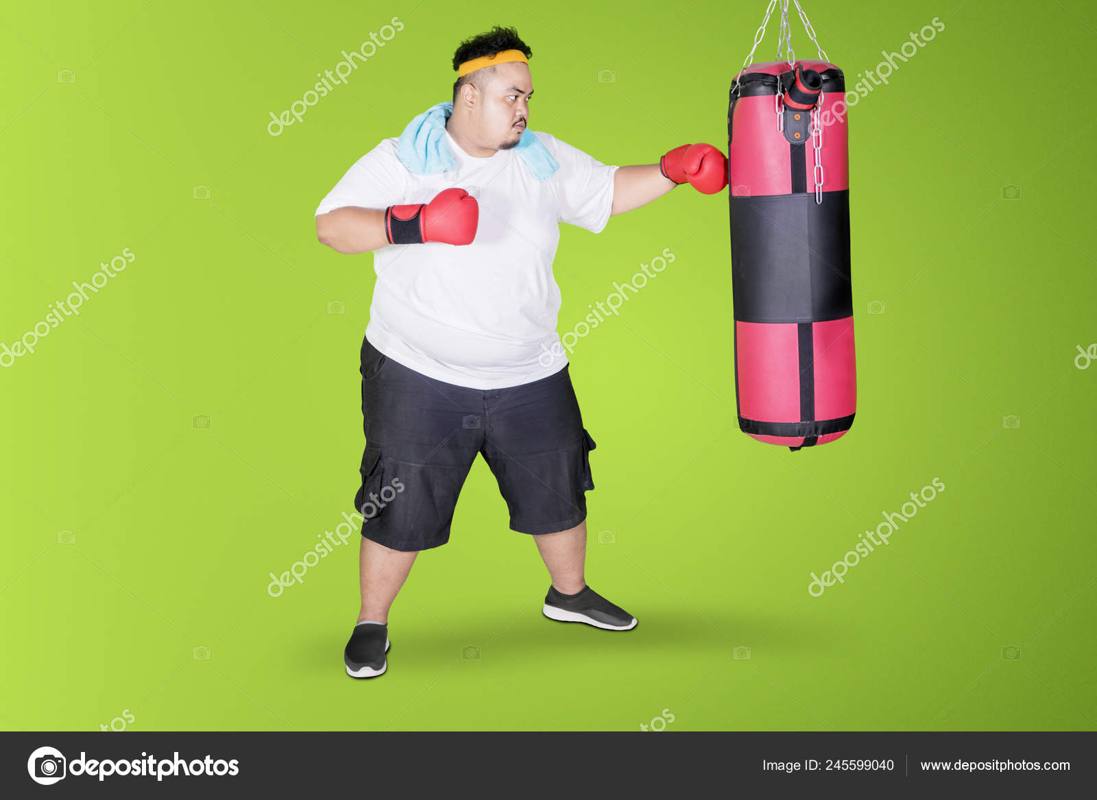 Image Overweight Man Punching Boxing Bag Exercising Studio Green Screen ...
