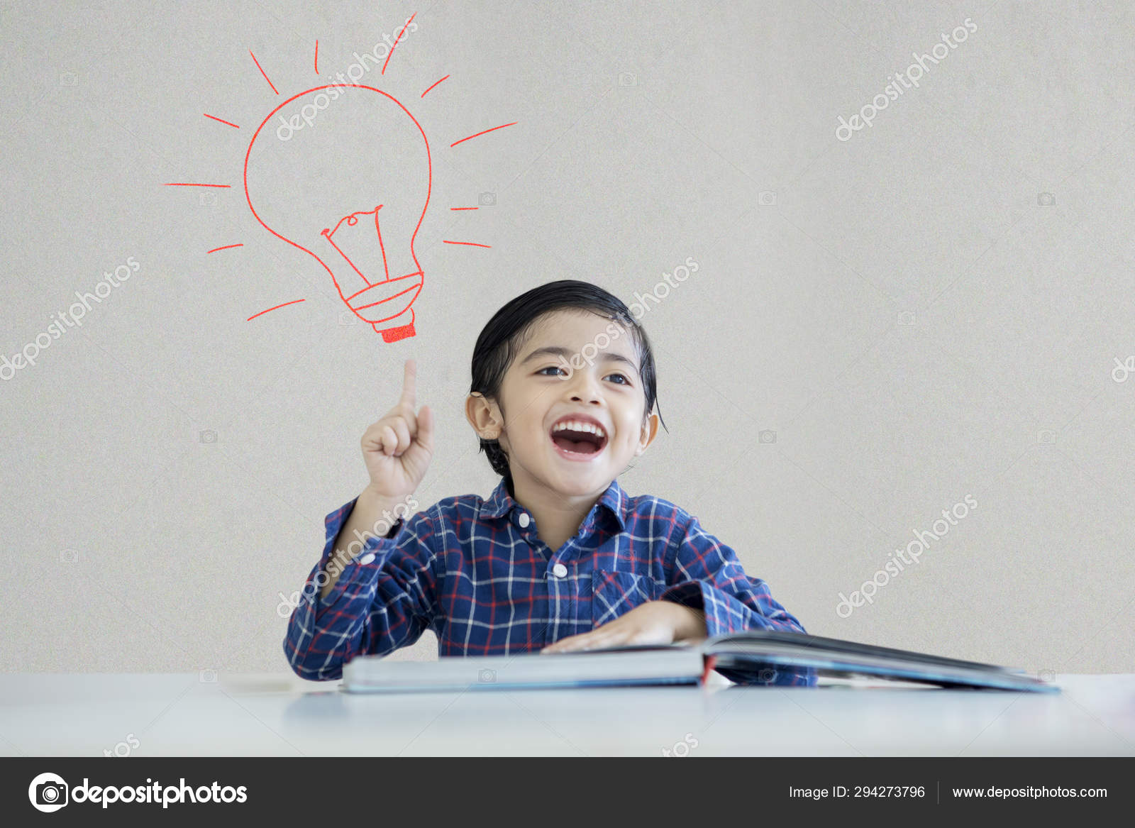 Little boy thinking an idea under a light bulb — Stock Photo ...