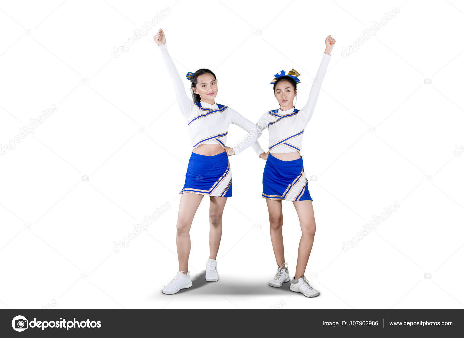 Two cheerleaders lifting hand on studio Stock Photo by ©realinemedia ...