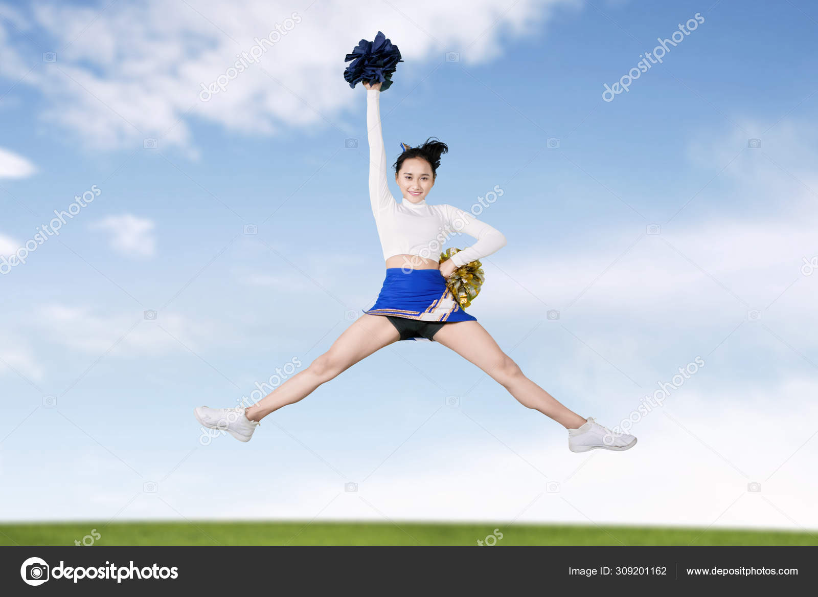 Cheerleader girl dances with pom poms in meadow — Stock Photo ...