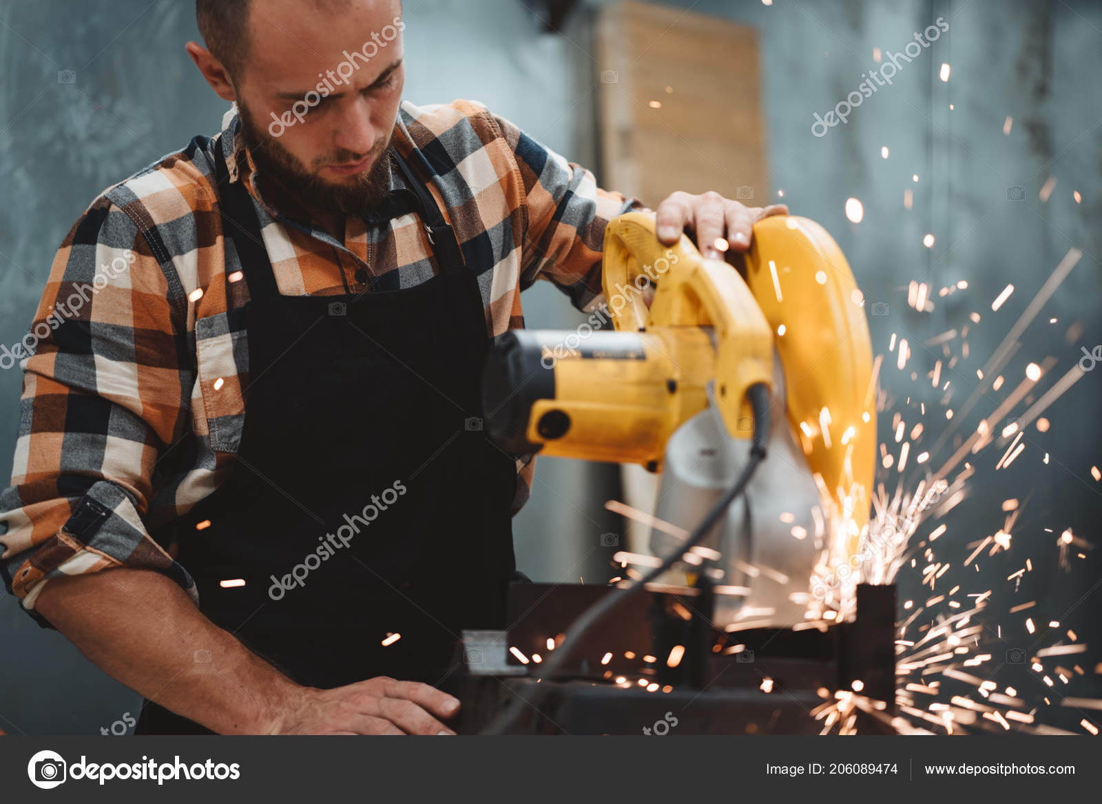 Strong Bearded Man Working Electrical Angular Grinding Machine ...